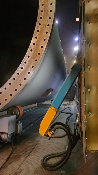 BLAST CLEANING OF EXTERIOR SURFACE OF WIND TURBINE TOWERS - Blastman ...